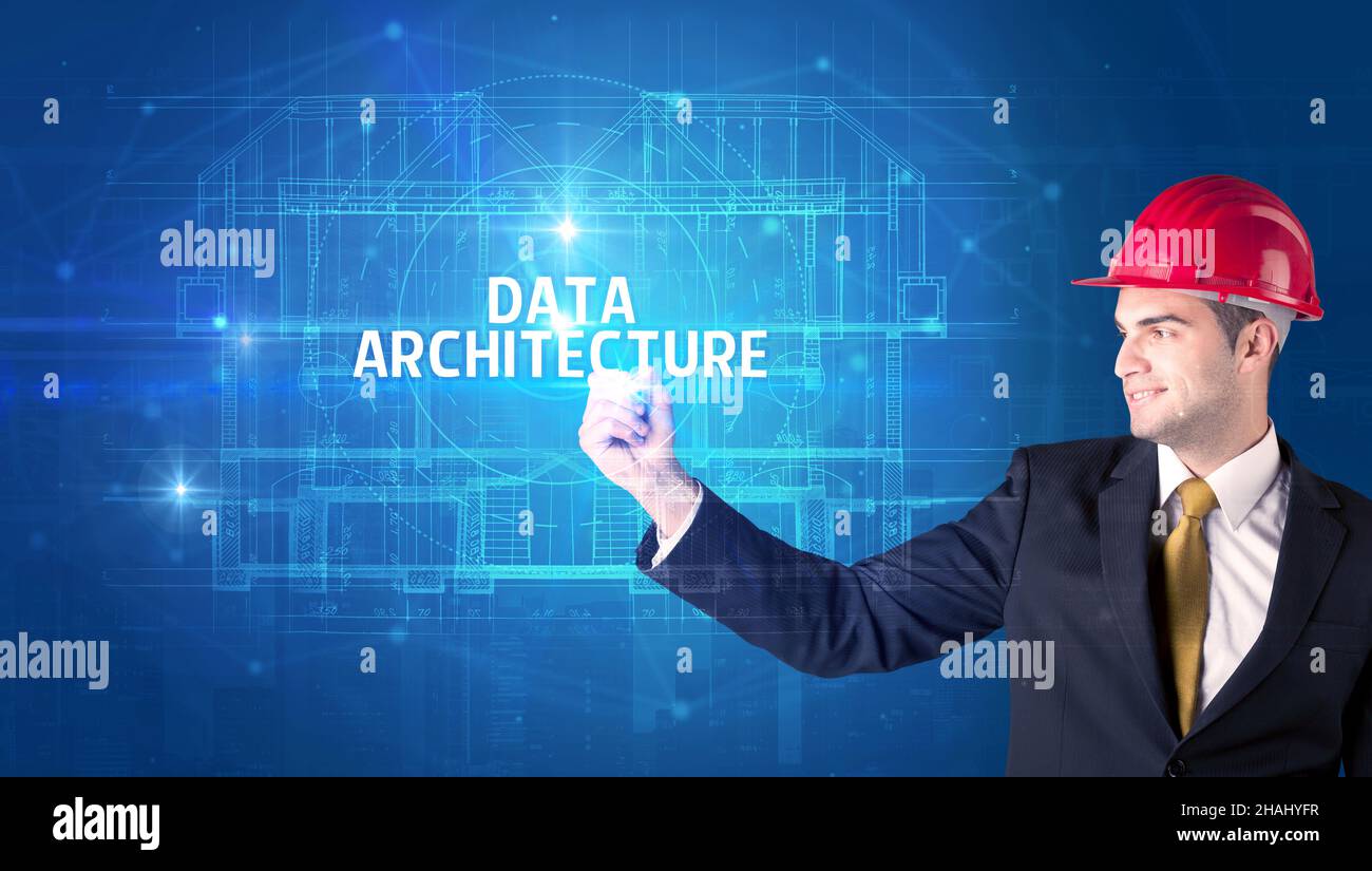 Handsome architect drawing with helmet Stock Photo - Alamy