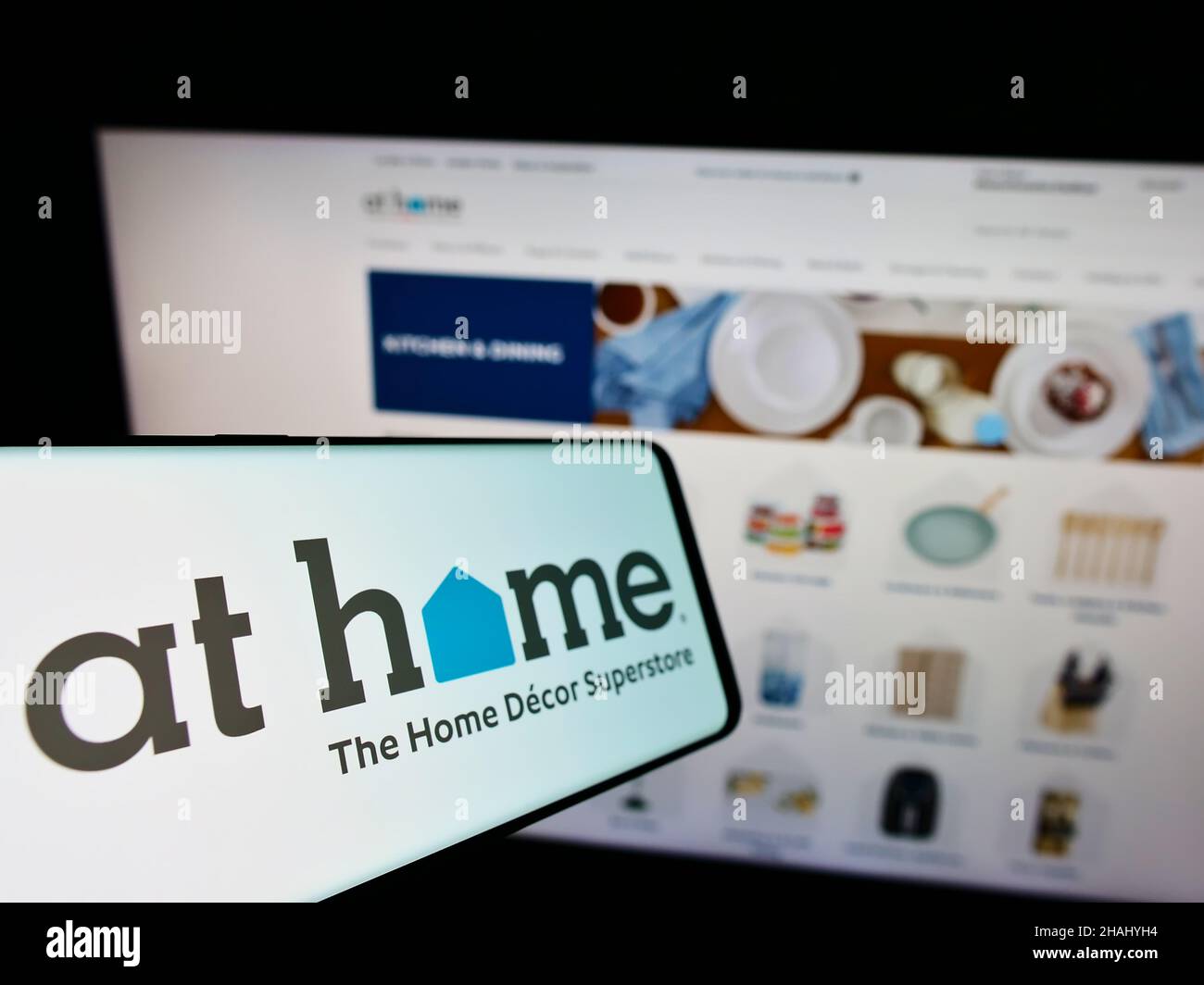 Smartphone with logo of US home decor company At Home Group Inc. on ...