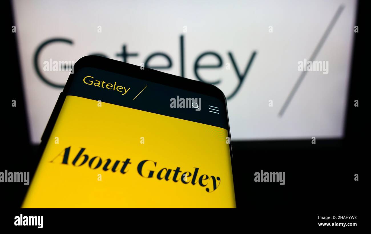 Mobile phone with webpage of British legal services company Gateley ...