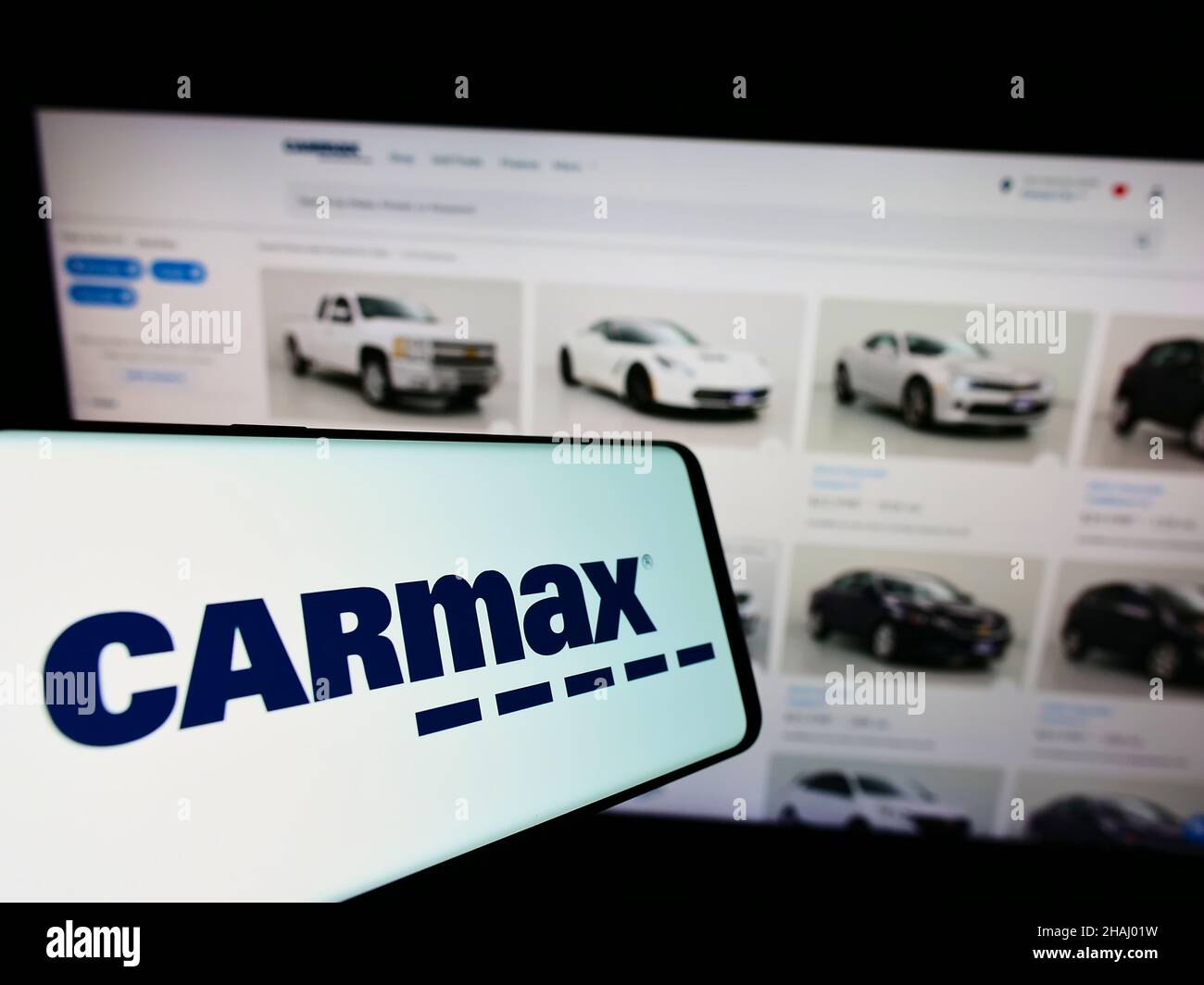 Mobile phone with logo of US vehicle retailer CarMax Business Services ...