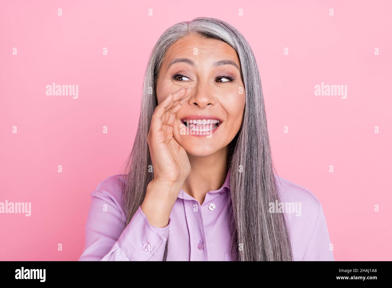 Portrait of attractive cheerful gray-haired woman saying good news ...