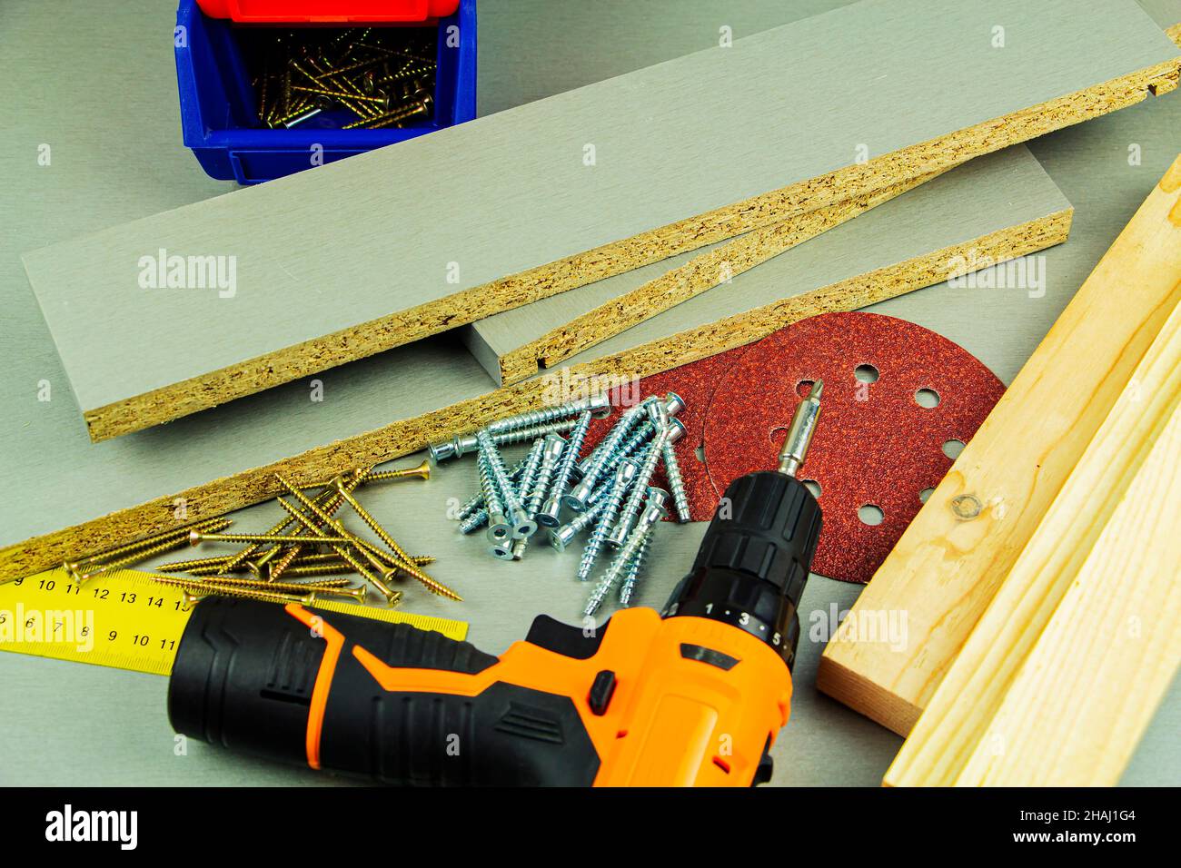 furniture assembly tools, screws, chipboard screwdriver ruler sandpaper ...