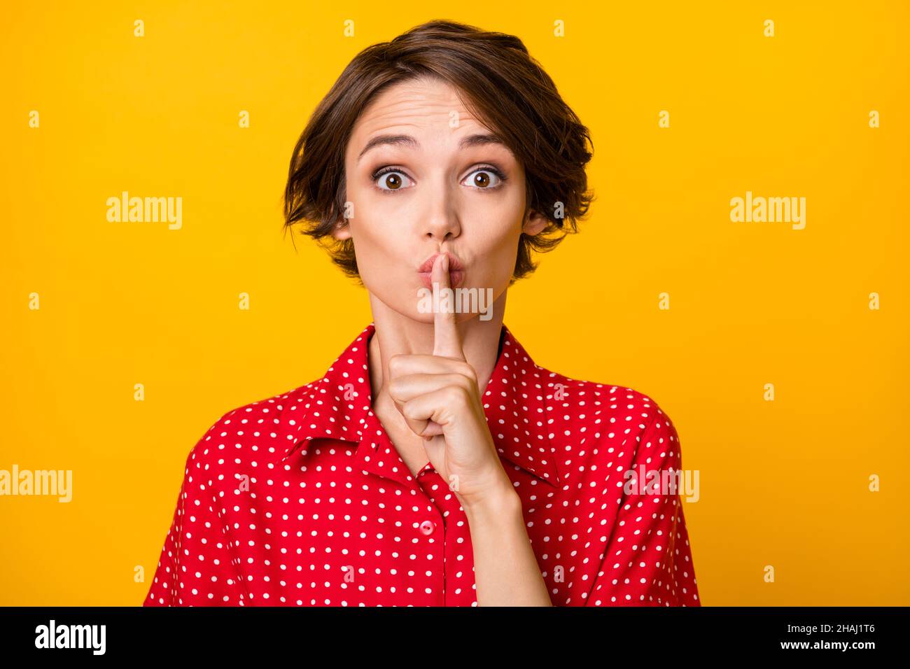 Portrait of young girl finger covering lips mouth do not tell look ...