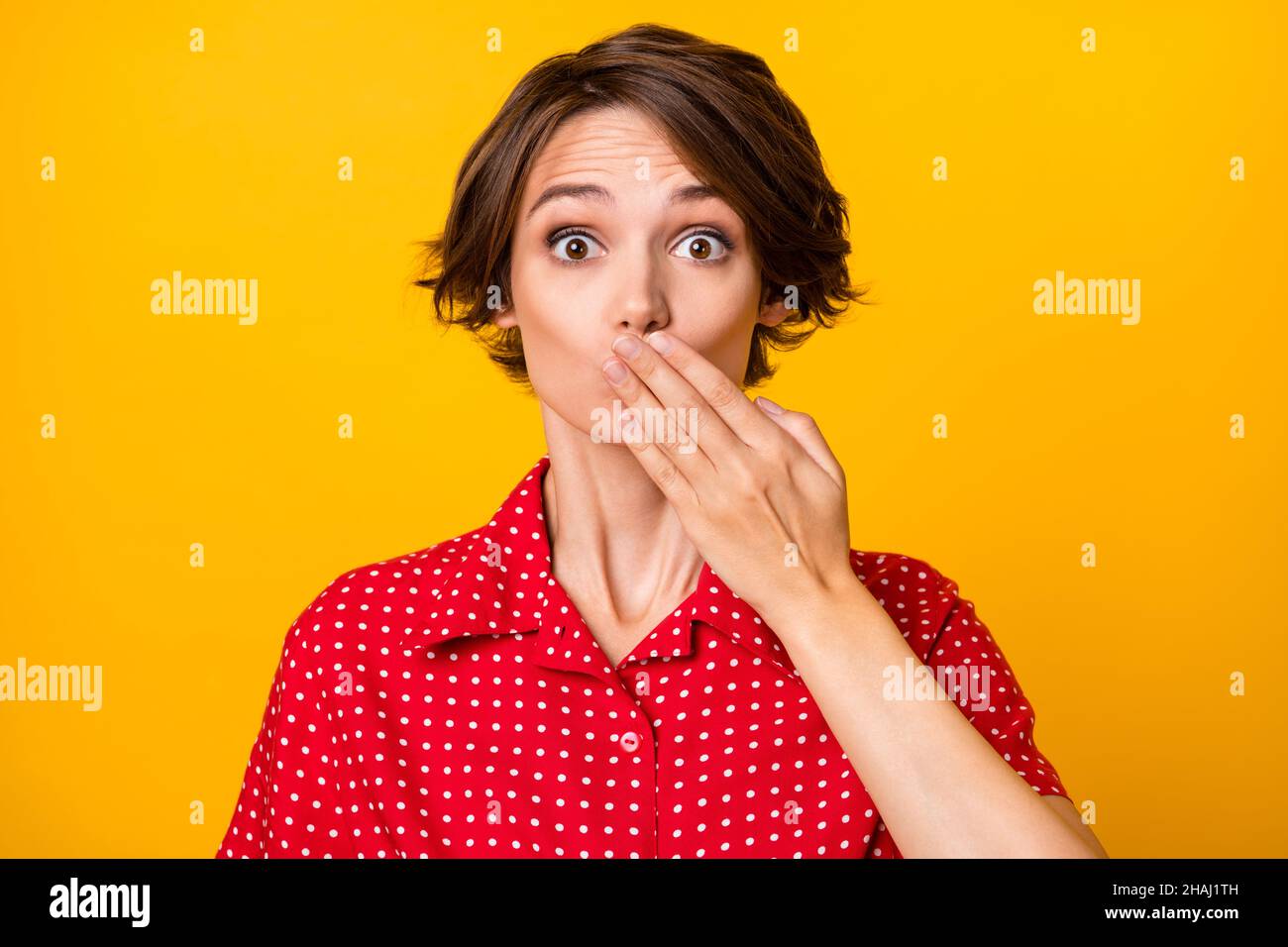 Photo of worried lady arm palm covering mouth lips staring camera ...