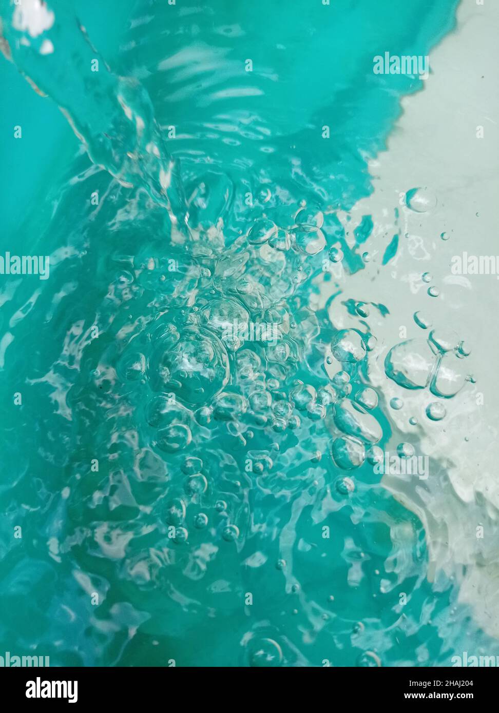 Clear water drops flowing Stock Photo - Alamy