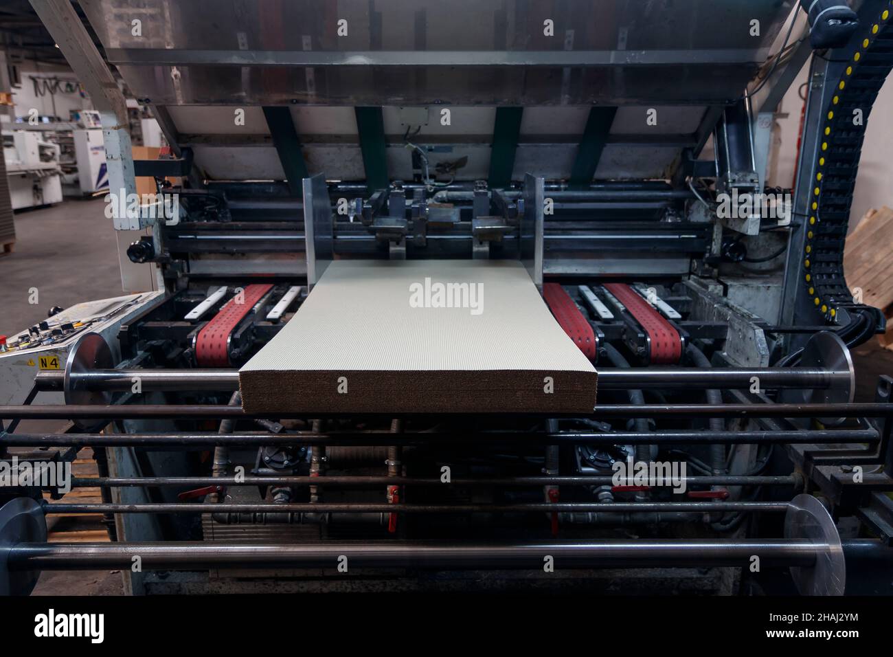Industrial machinery at work inside a facility Stock Photo - Alamy