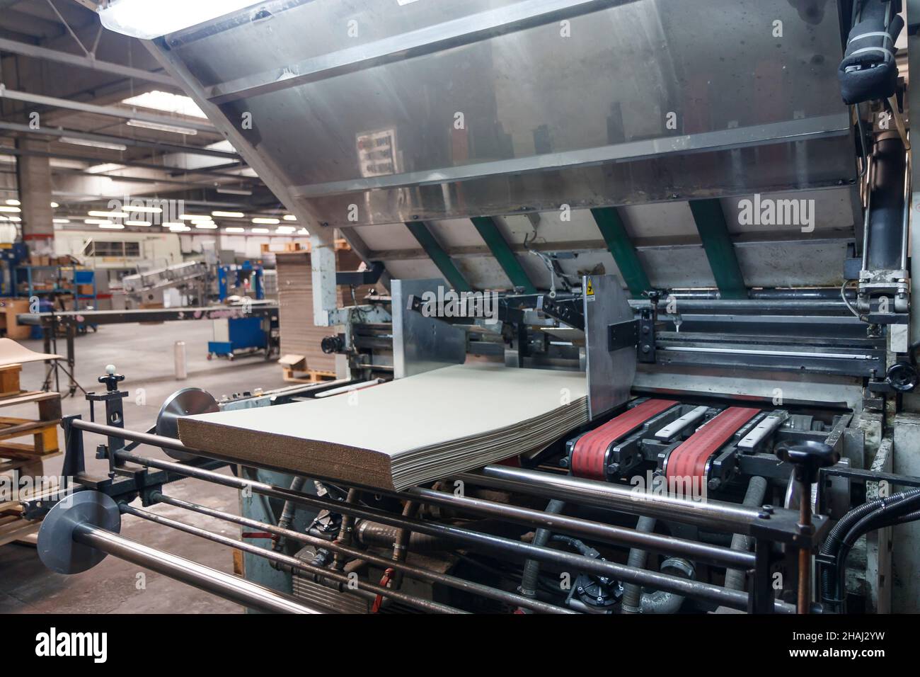 Industrial machinery at work inside a facility Stock Photo - Alamy