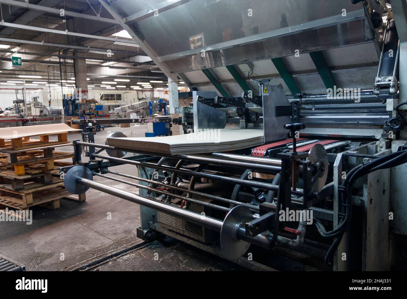 Industrial machinery at work inside a facility Stock Photo - Alamy