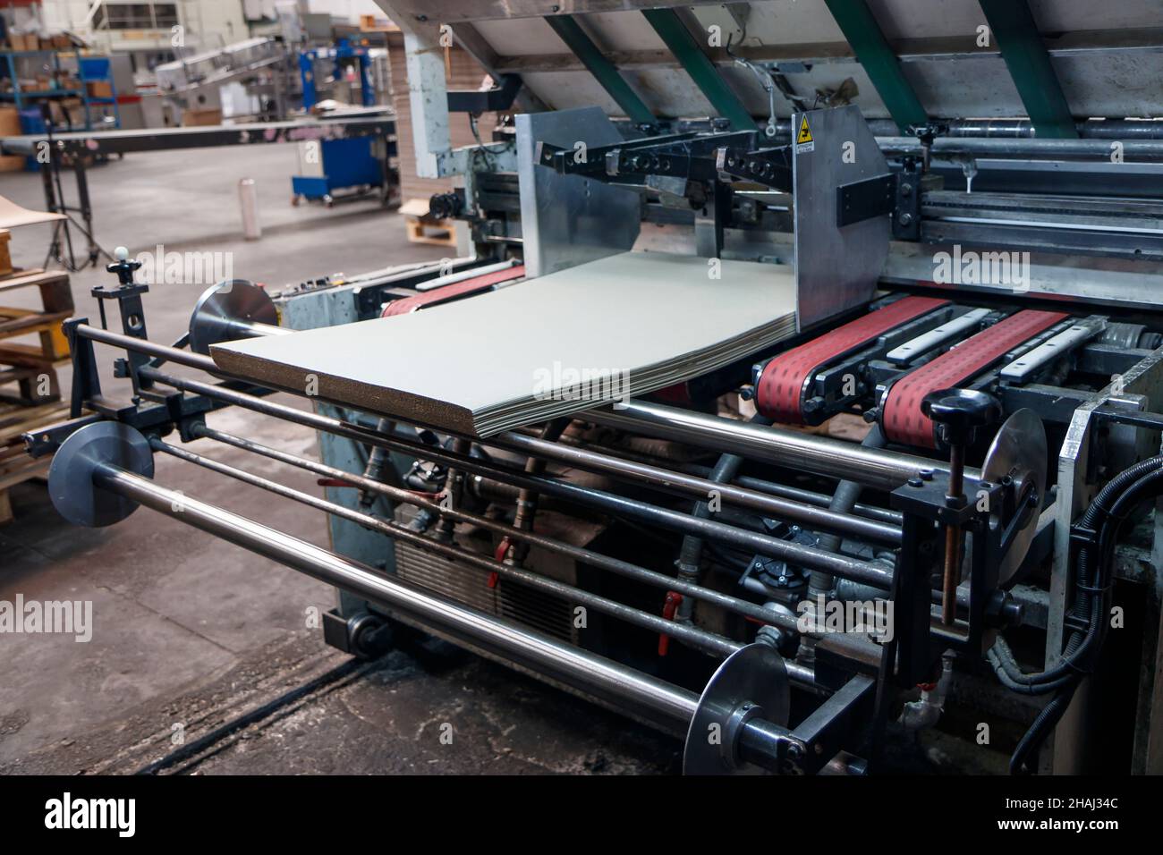 Industrial machinery at work inside a facility Stock Photo - Alamy