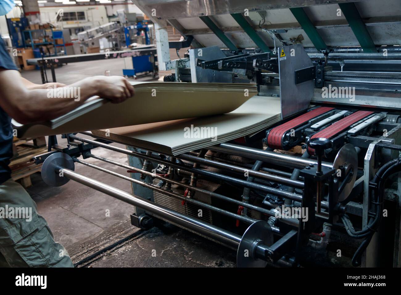 Industrial machinery at work inside a facility Stock Photo - Alamy