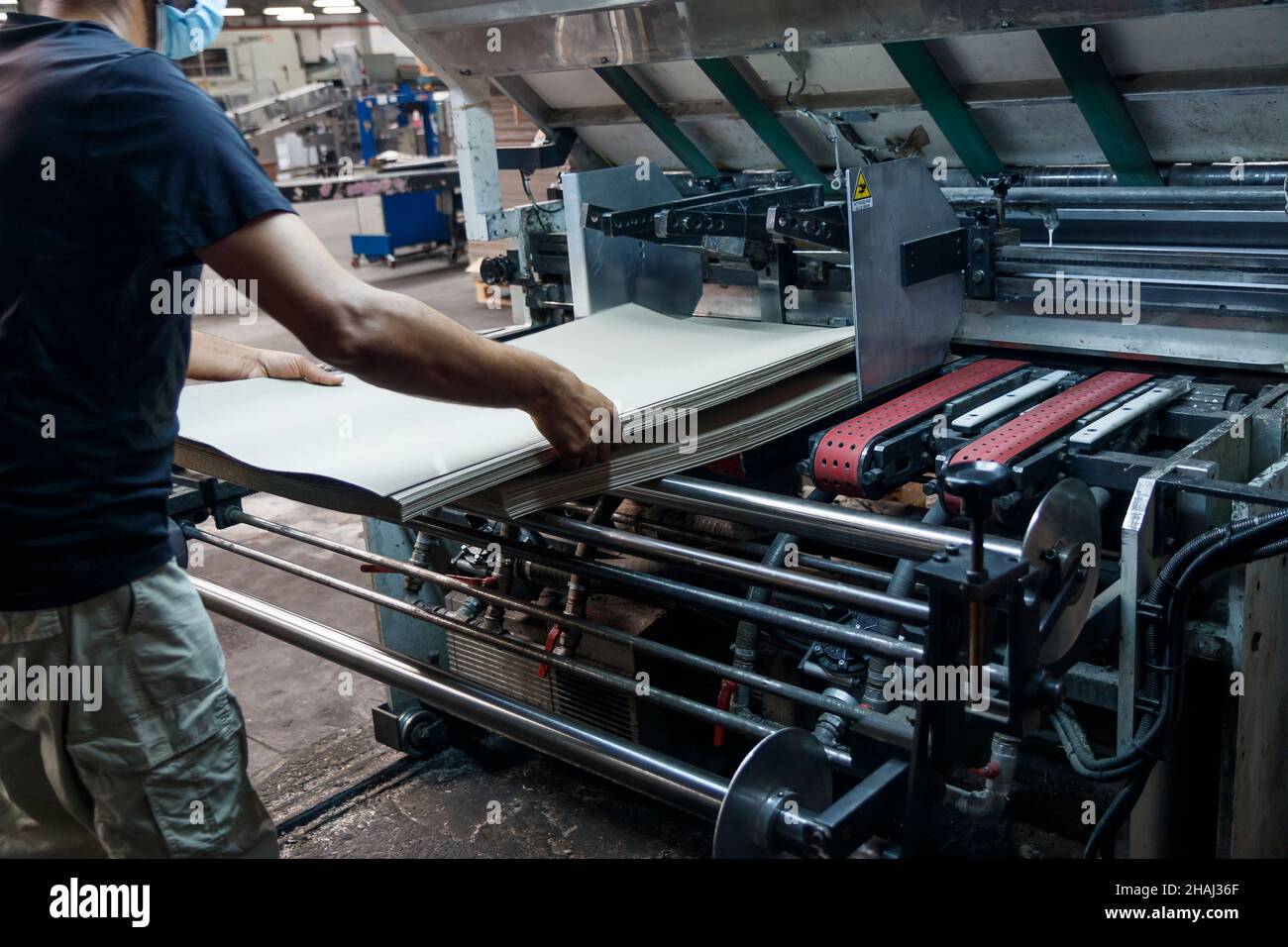 Industrial machinery at work inside a facility Stock Photo - Alamy