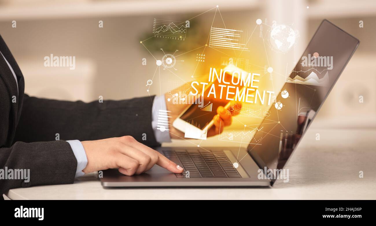 Side view of a business person working on laptop Stock Photo - Alamy