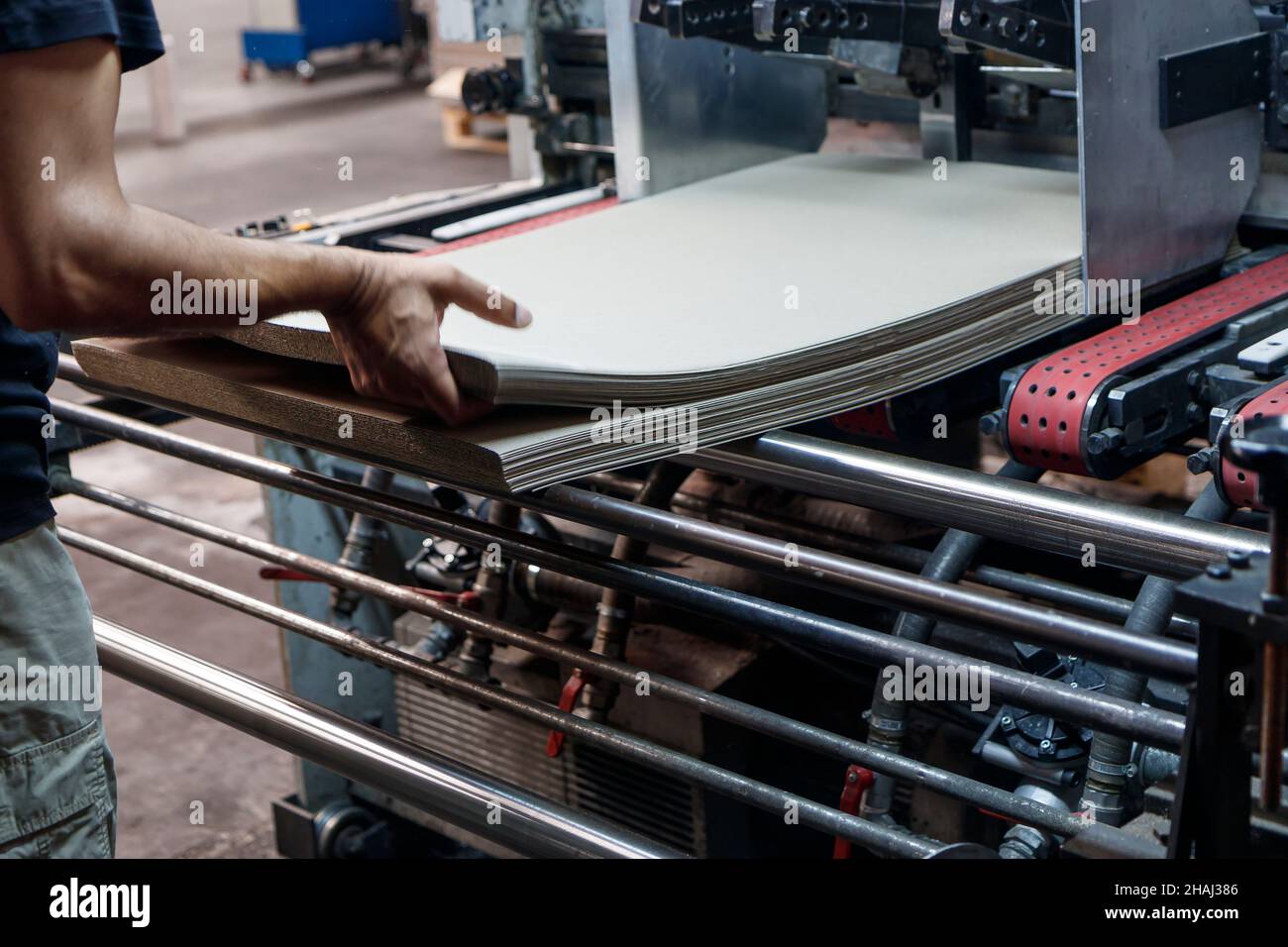 Industrial machinery at work inside a facility Stock Photo - Alamy