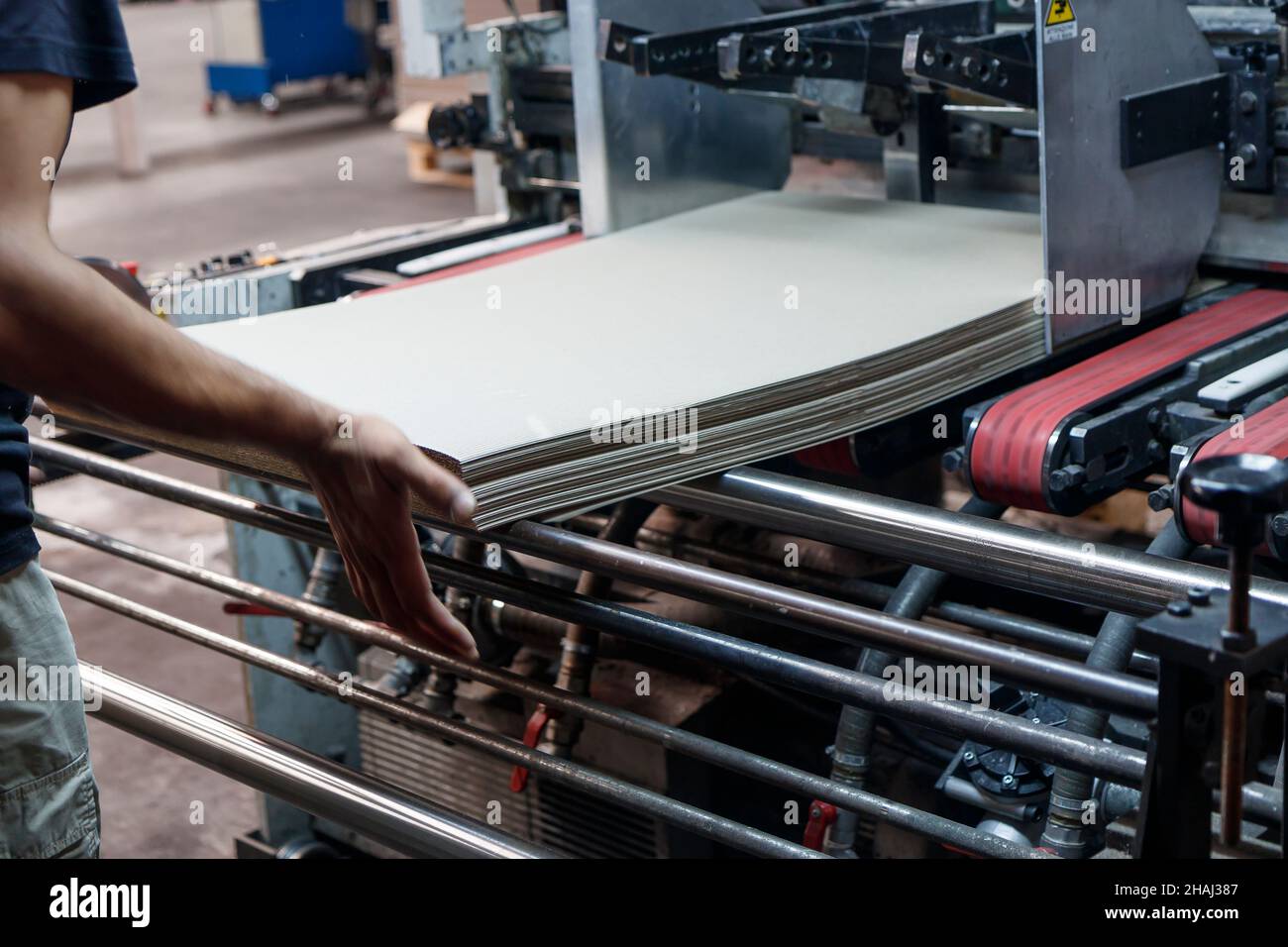 Industrial machinery at work inside a facility Stock Photo - Alamy