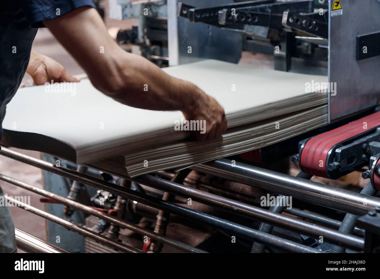 Industrial machinery at work inside a facility Stock Photo - Alamy