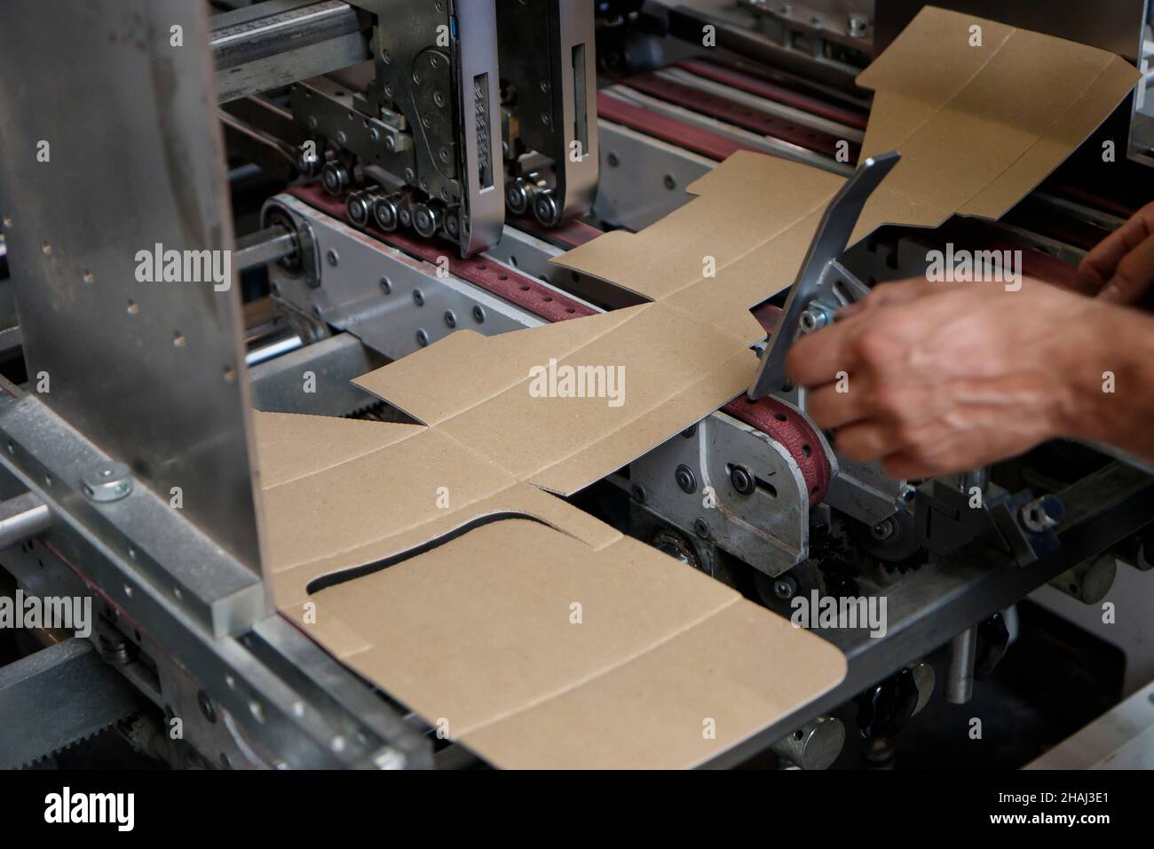 Industrial machinery at work inside a facility Stock Photo - Alamy