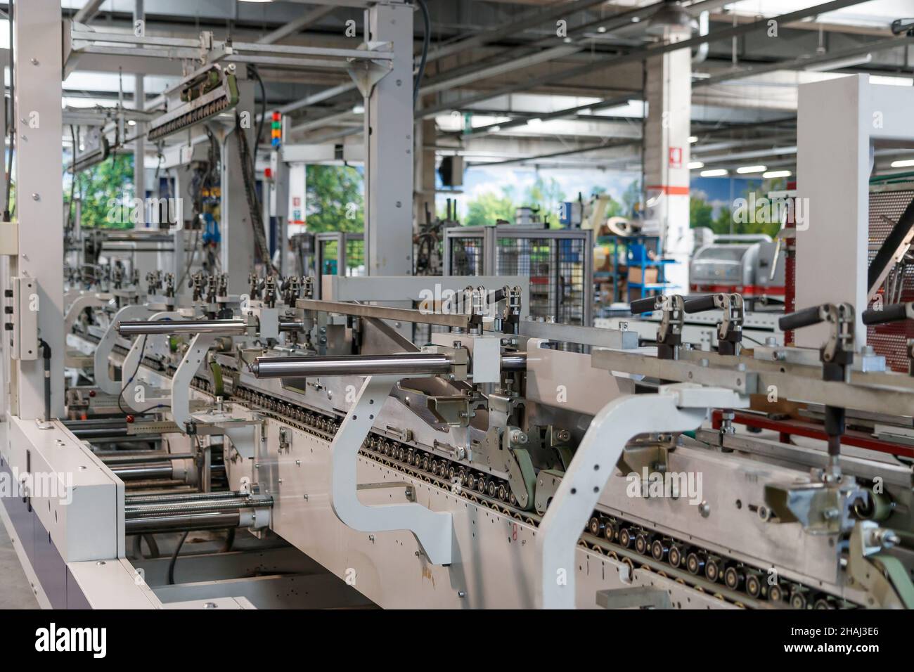 Industrial machinery at work inside a facility Stock Photo - Alamy