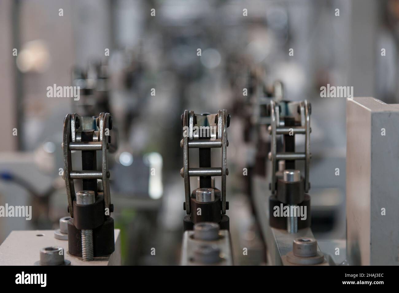 Industrial machinery at work inside a facility Stock Photo - Alamy