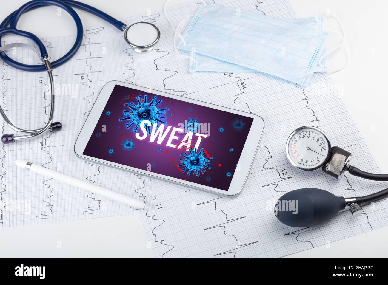 Tablet pc and doctor tools on white surface Stock Photo - Alamy