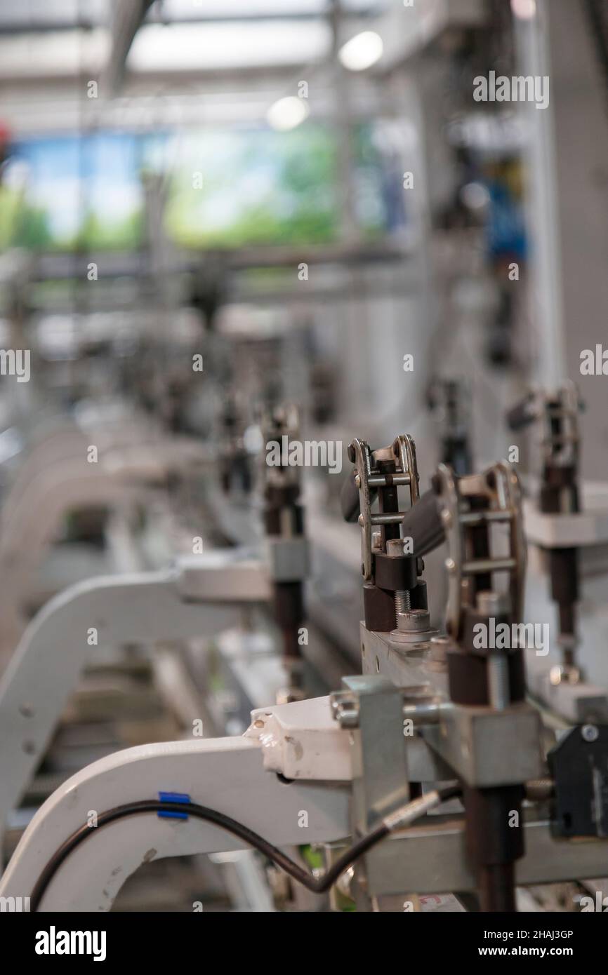 Industrial machinery at work inside a facility Stock Photo - Alamy