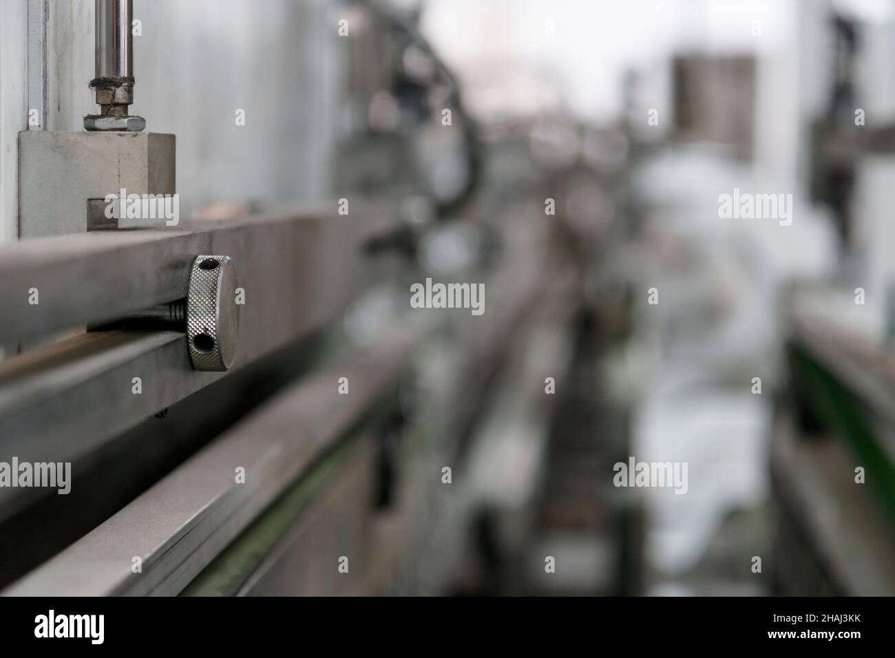 Industrial machinery at work inside a facility Stock Photo - Alamy
