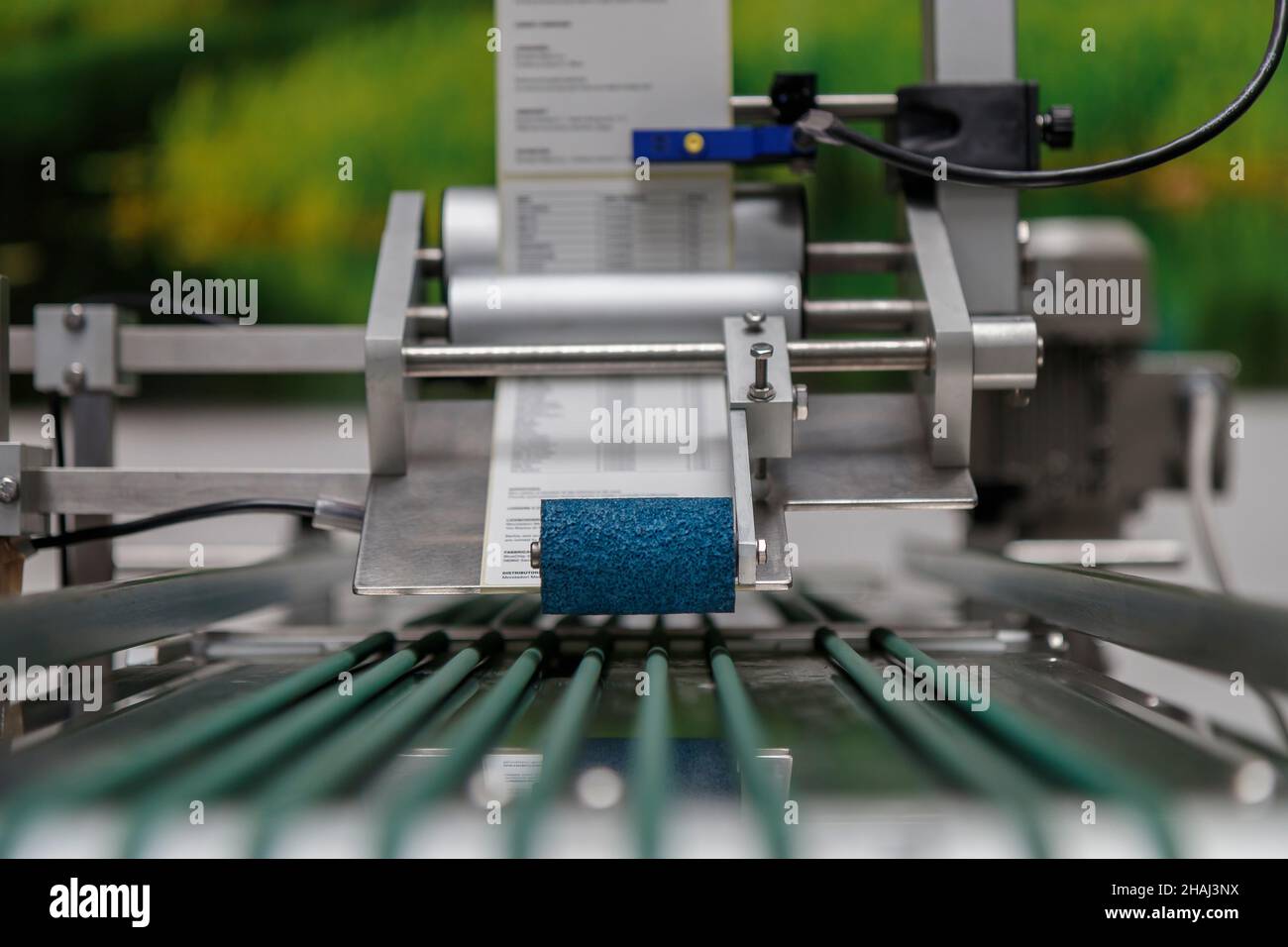 Industrial machinery at work inside a facility Stock Photo - Alamy