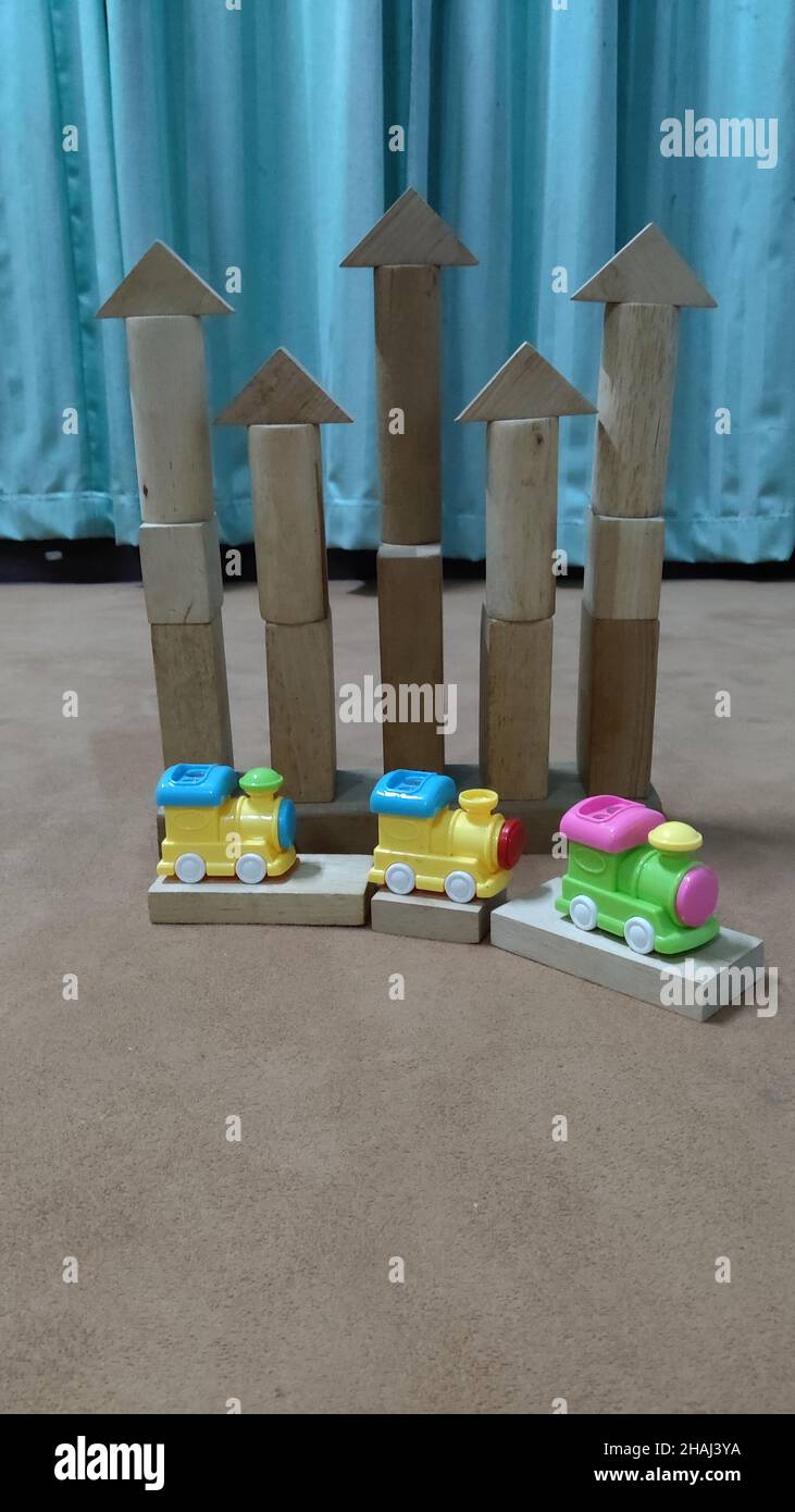 Children colourful train toy's with wooden block Stock Photo - Alamy