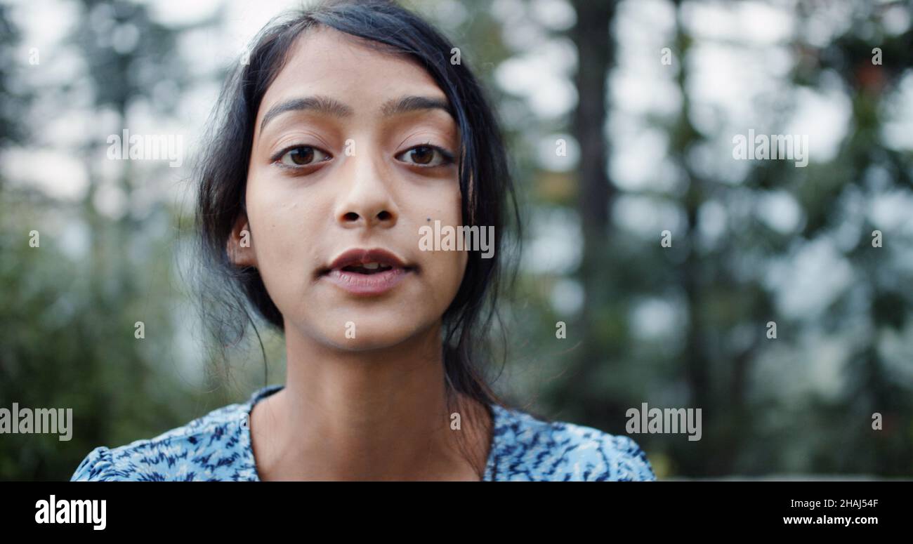 Portrait of a South Asian female outdoors looking upfront Stock Photo ...