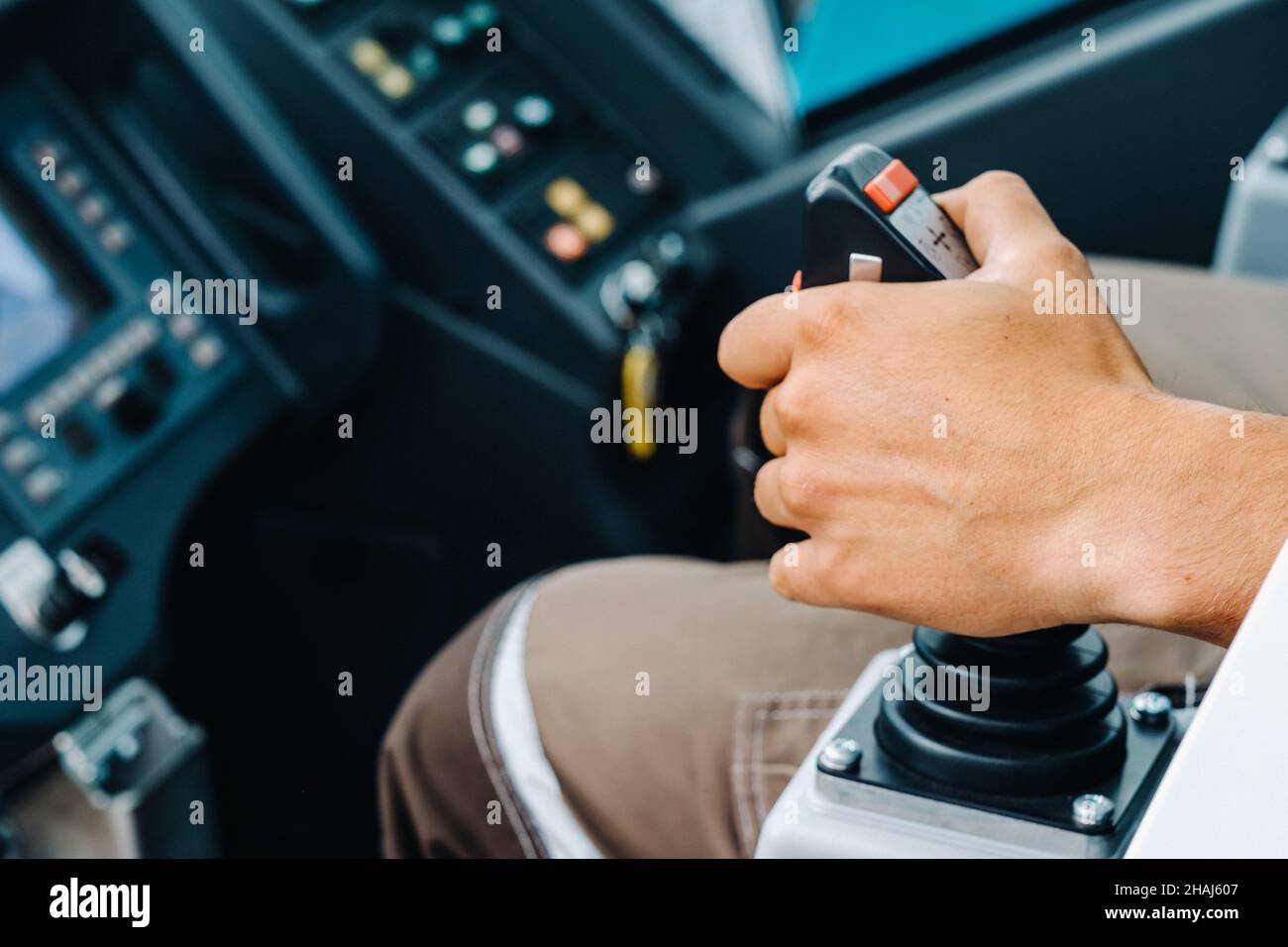 Close-up of a hand holding a joystick to control a crane.Construction ...