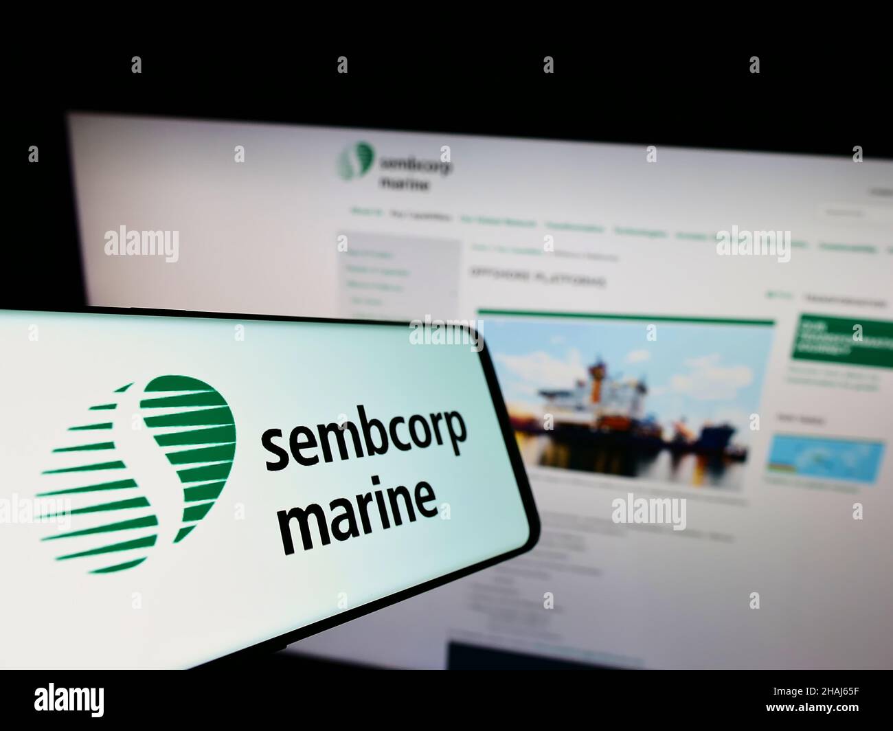 Cellphone with logo of Singaporean company Sembcorp Industries Ltd on ...