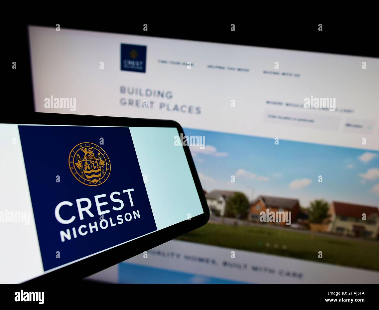 Cellphone with logo of British housebuilding company Crest Nicholson ...