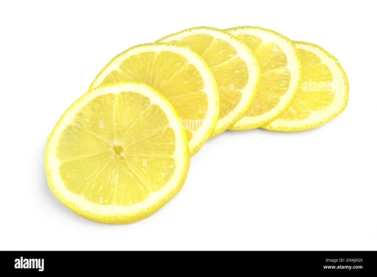 Lemon slices over white background Stock Photo - Alamy