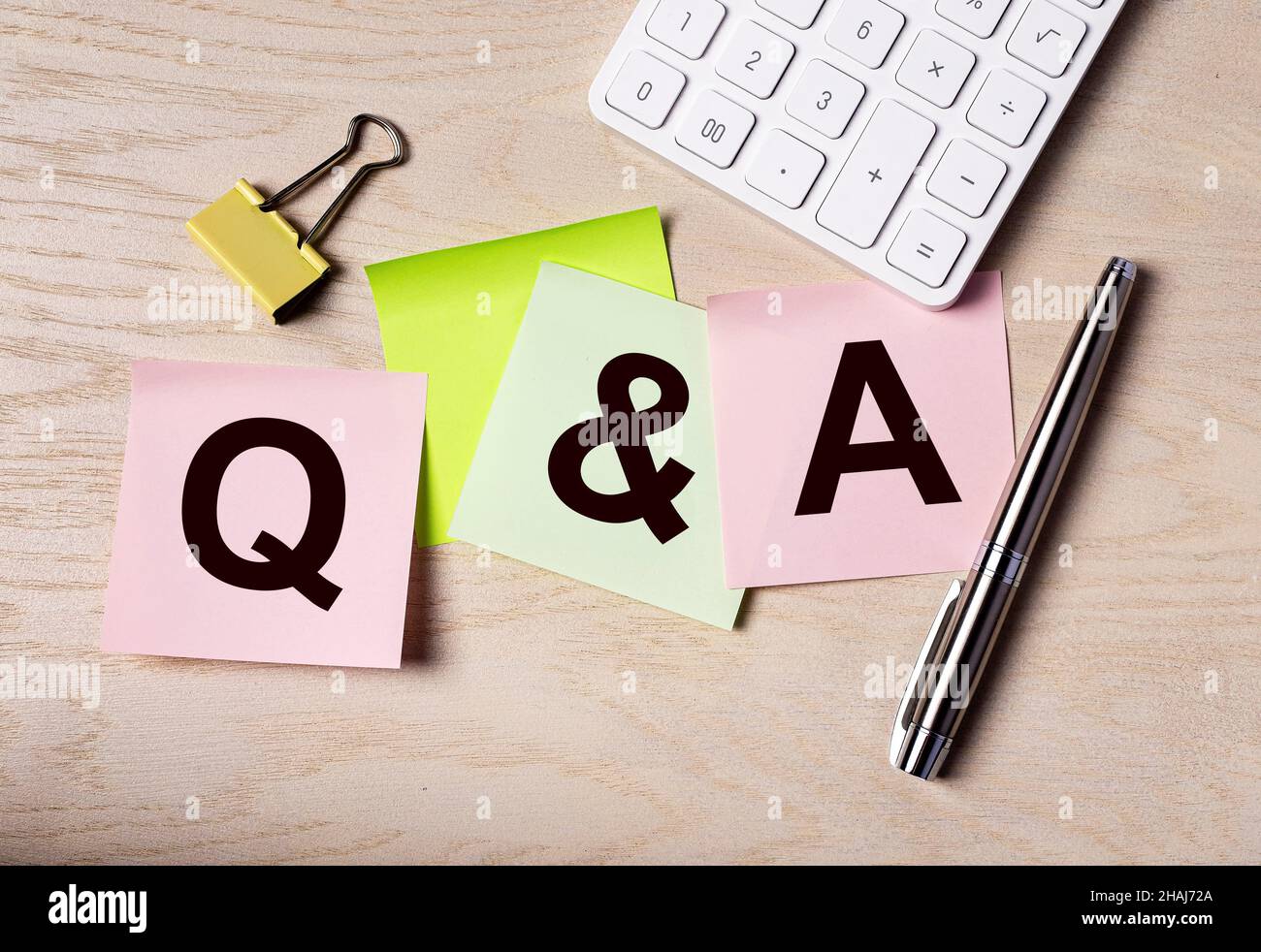 Q concept. Q and A acronym on notes on office desk. QnA Stock Photo - Alamy