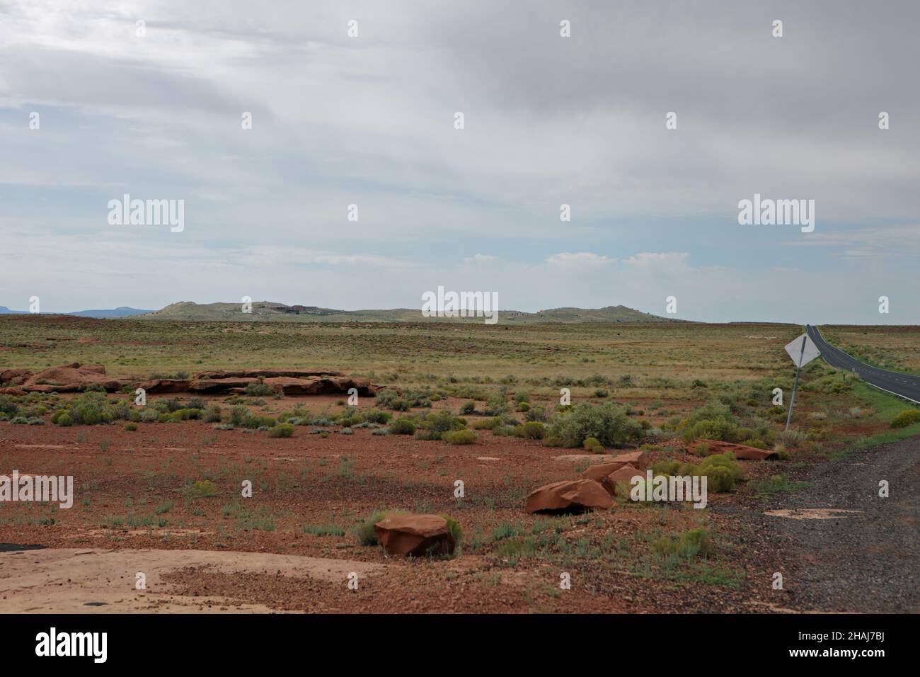 The upraised rim of Meteor Crater on the horizon near Winslow in ...