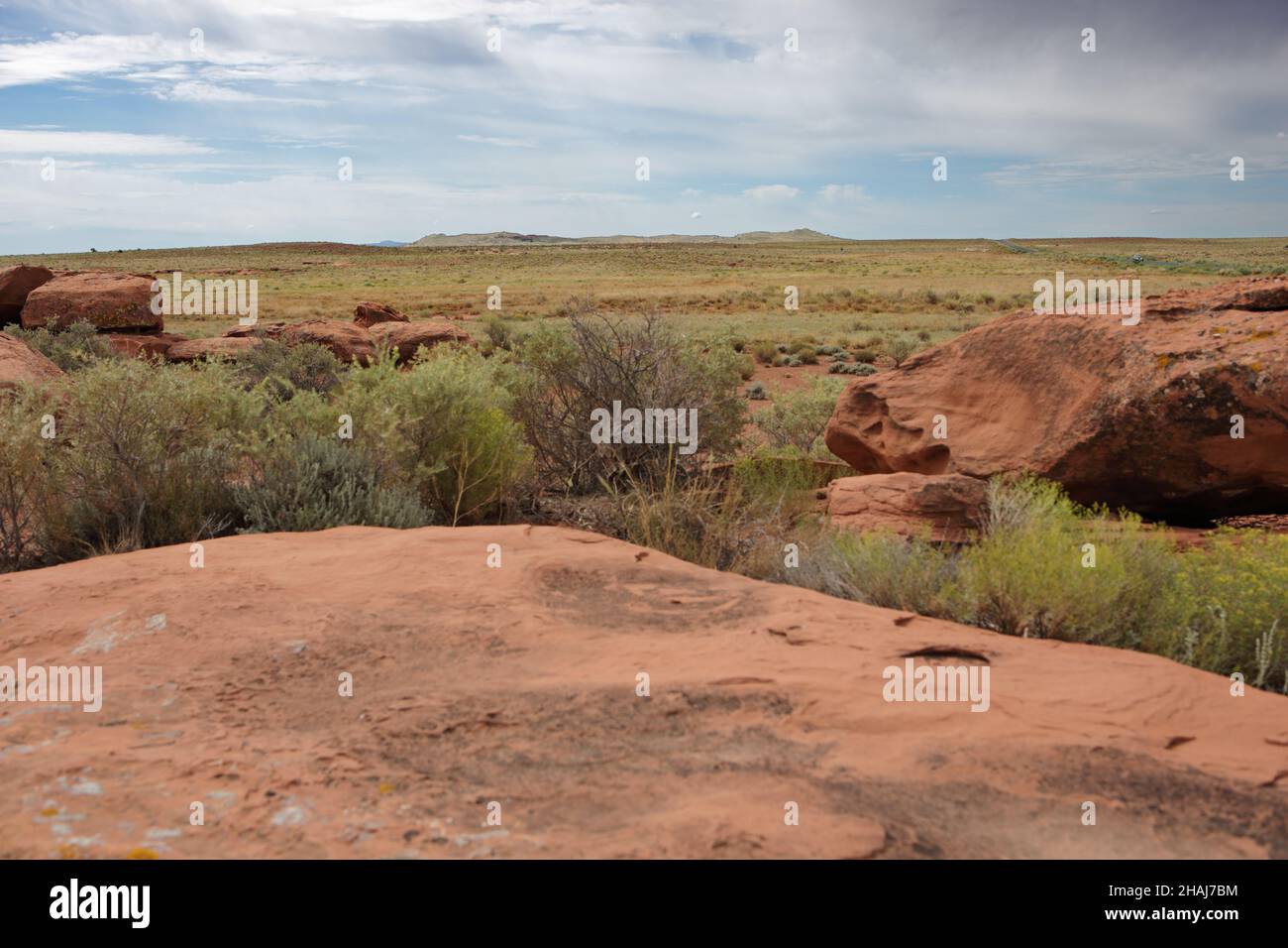 The upraised rim of Meteor Crater on the horizon near Winslow in ...