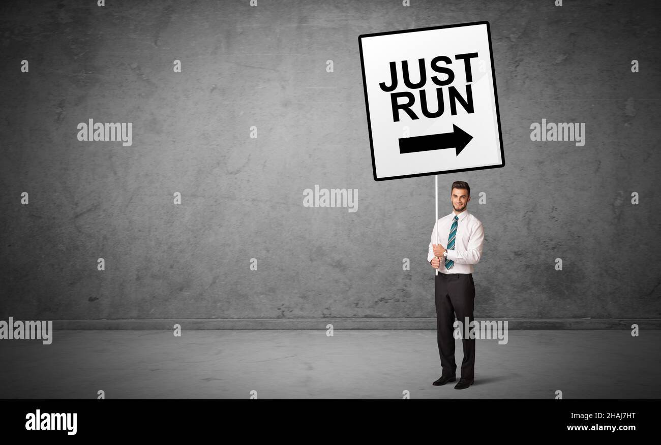 business person holding a traffic sign Stock Photo - Alamy