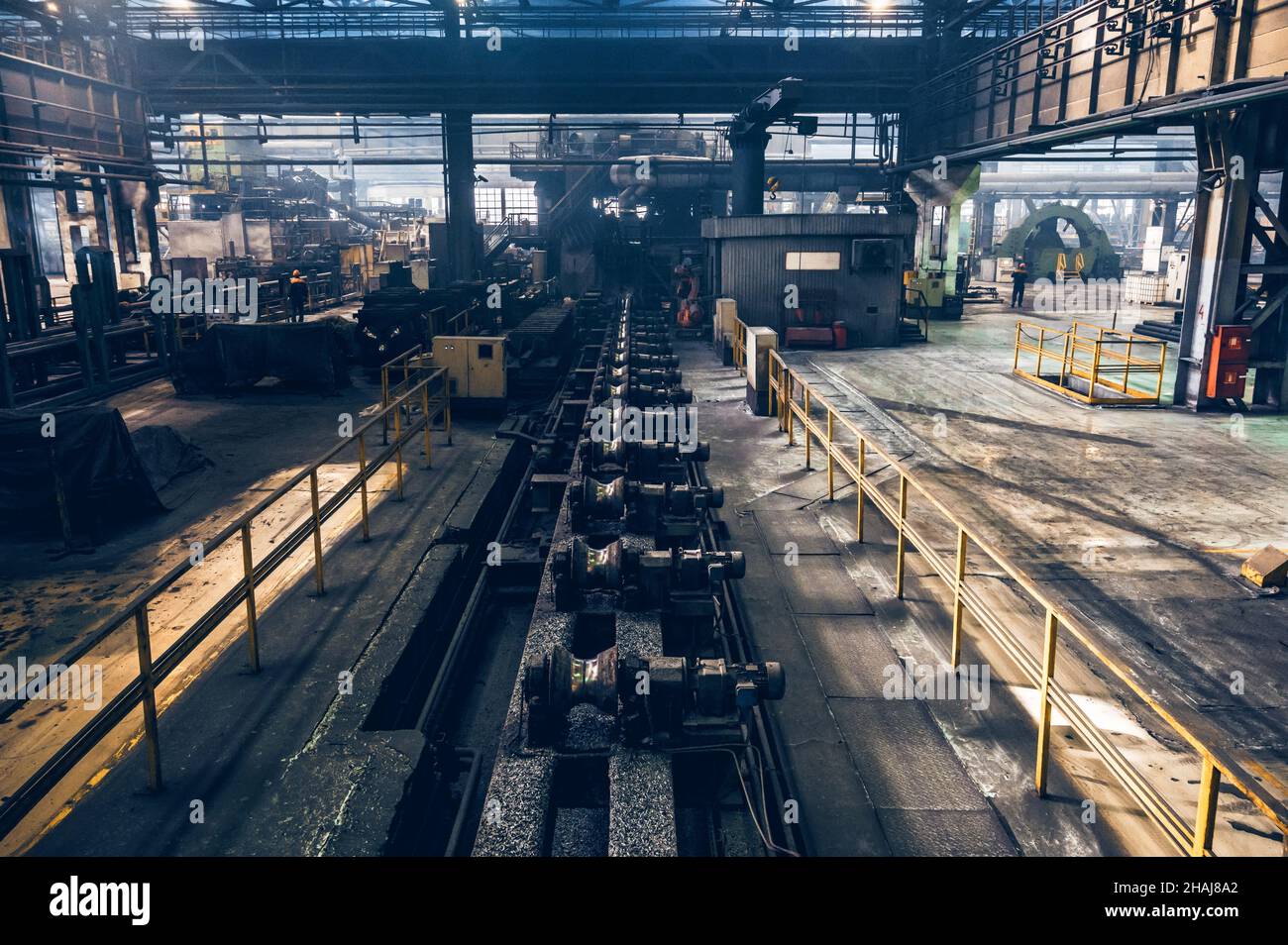 Steel pipe conveyor in the building of Iron and Steel Factory or Pipe ...