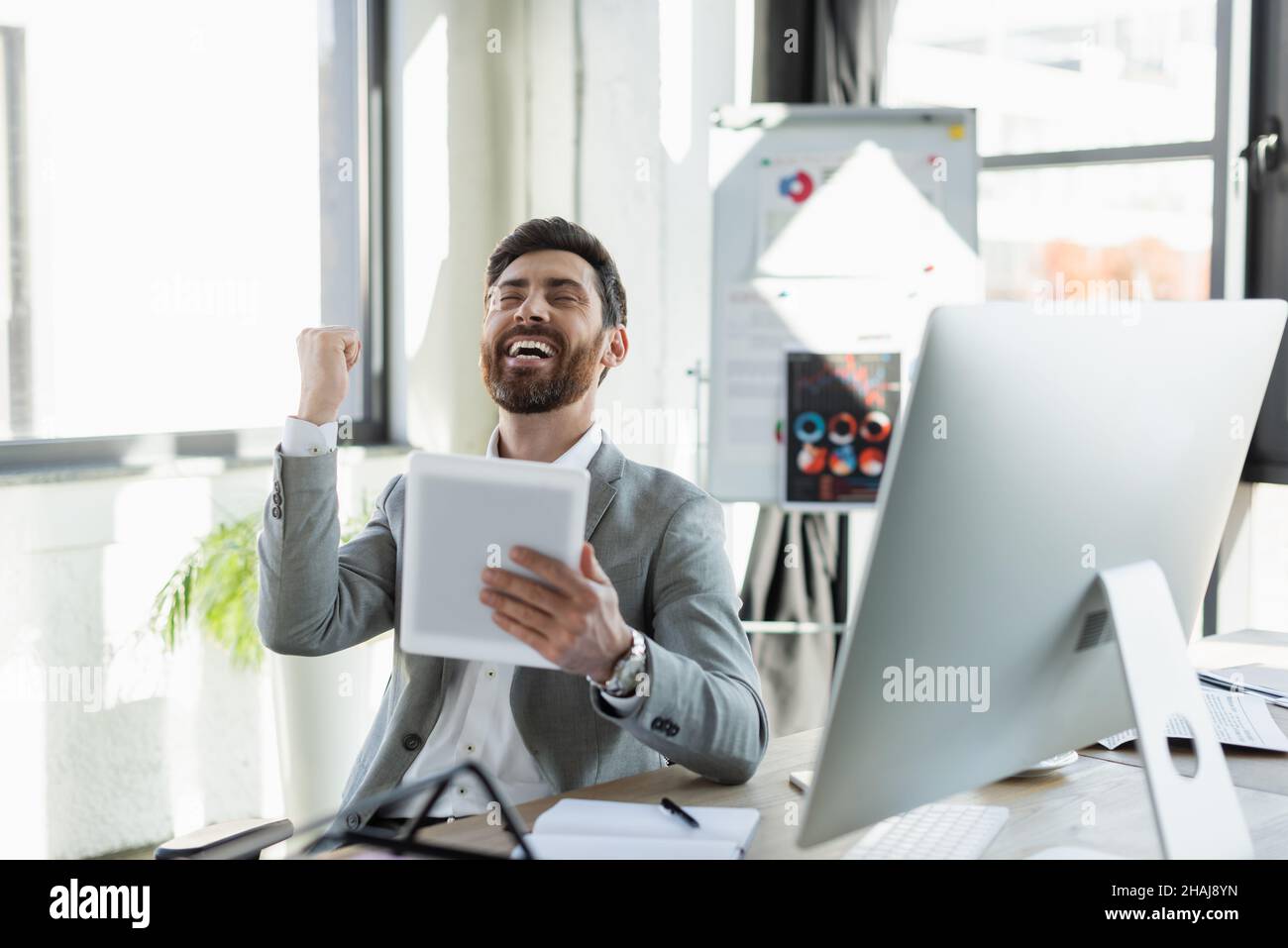 Excited businessman showing yes gesture hi-res stock photography and ...