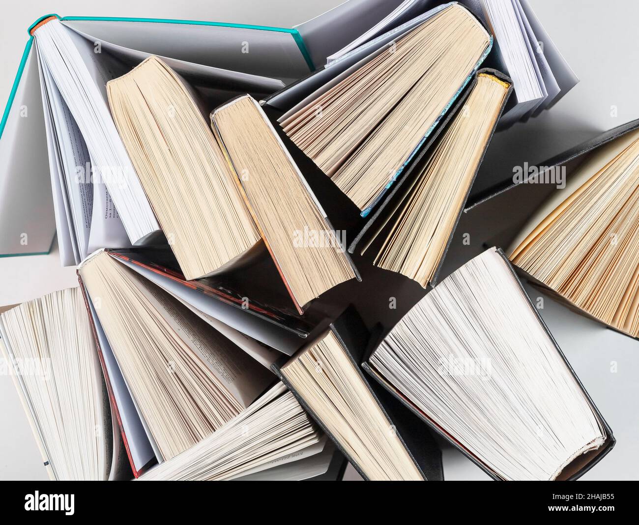 Books, textbooks, academic literature standing, top view. Paper ...