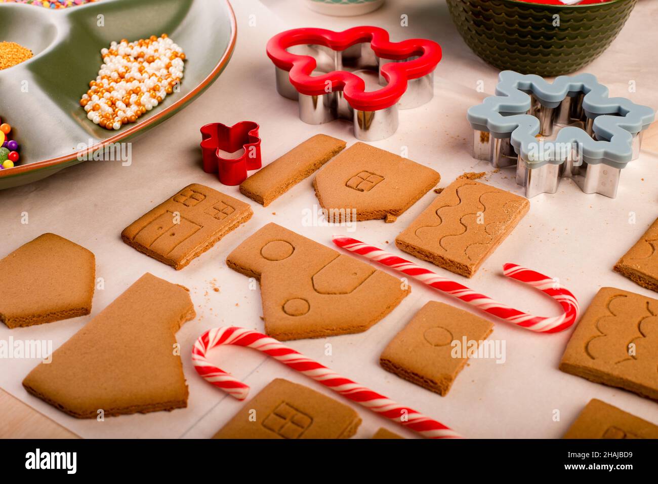 Gingerbread house cookies ready to be decorated with coloured royal ...
