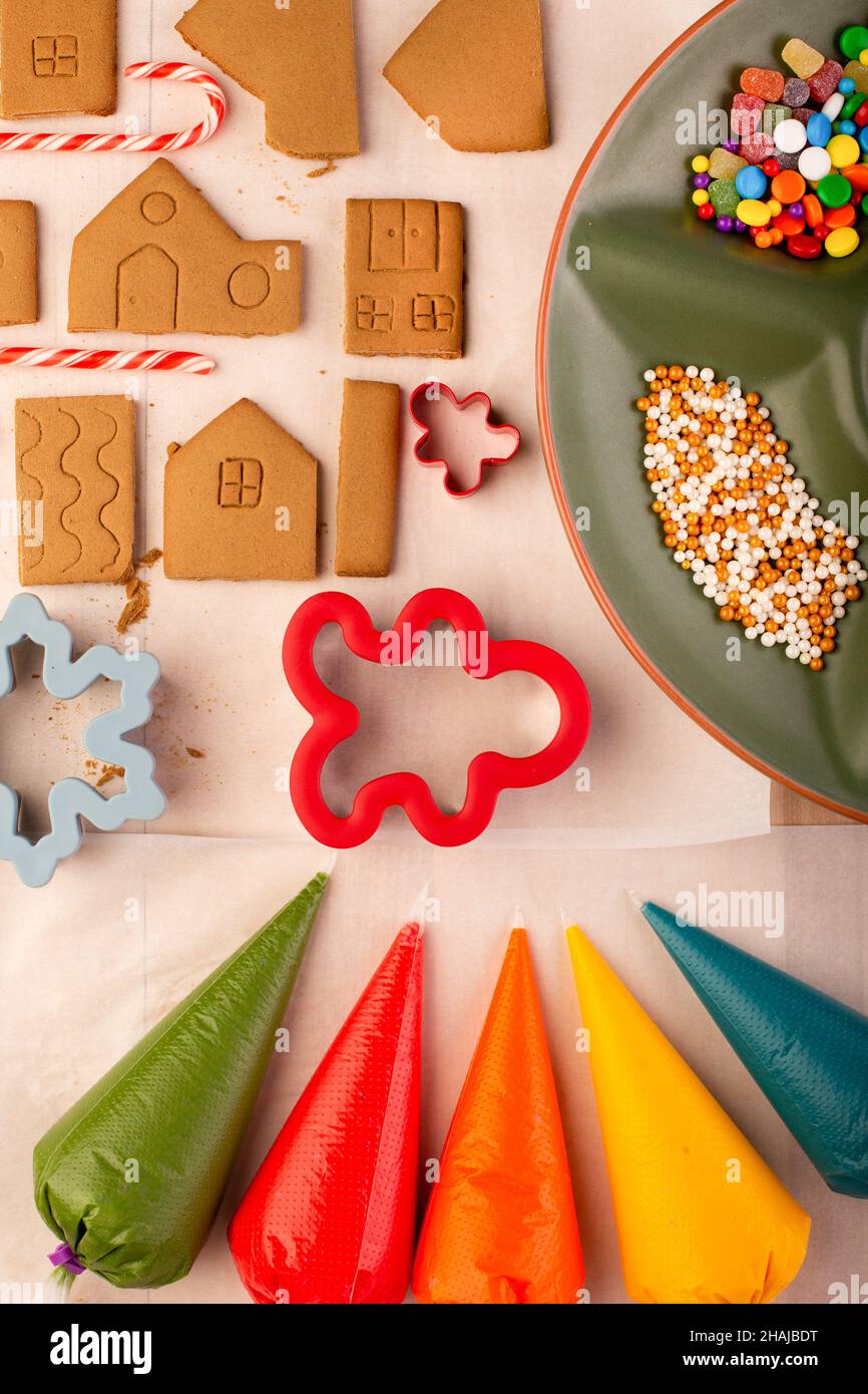 Gingerbread house cookies ready to be decorated with coloured royal ...