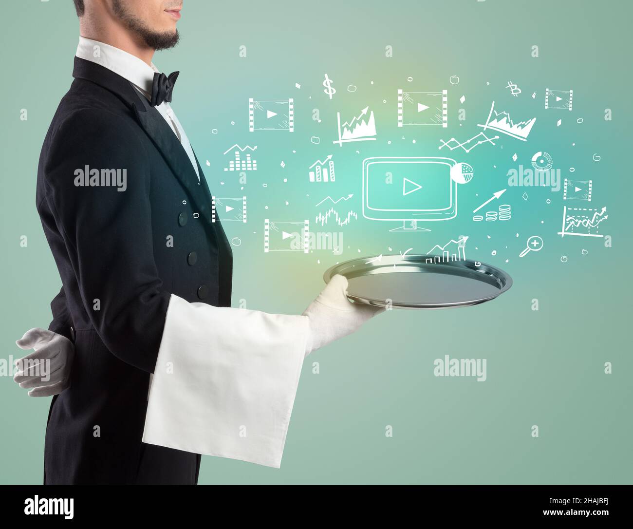 Handsome young waiter in tuxedo holding money icons on tray Stock Photo - Alamy