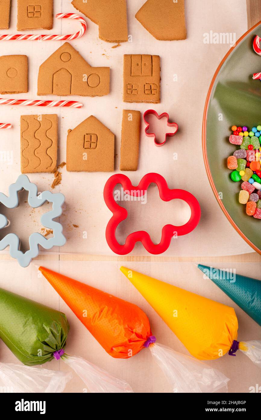 Gingerbread house cookies ready to be decorated with coloured royal ...