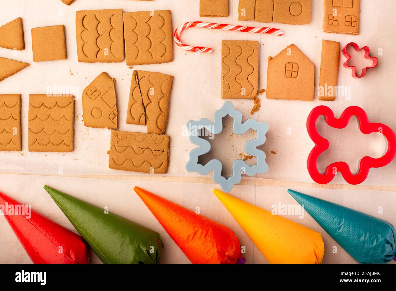 Gingerbread house cookies ready to be decorated with coloured royal ...