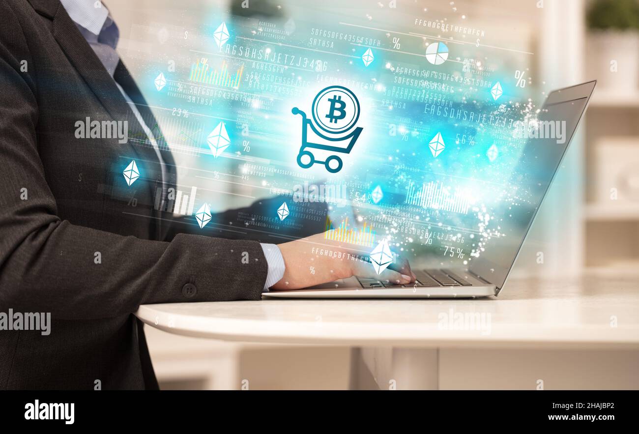 Young man watching stock market on laptop Stock Photo - Alamy