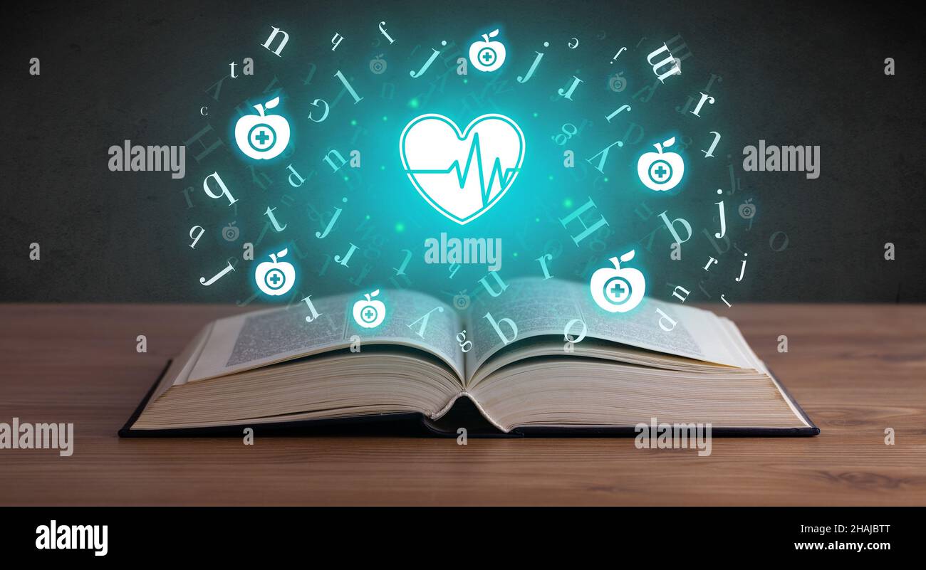 Open medical book with health icons above Stock Photo - Alamy