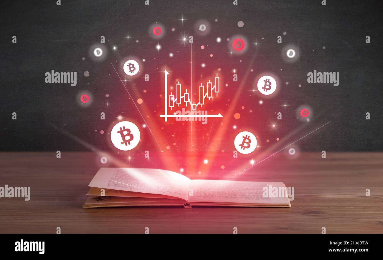 Open book with currency icons above Stock Photo - Alamy