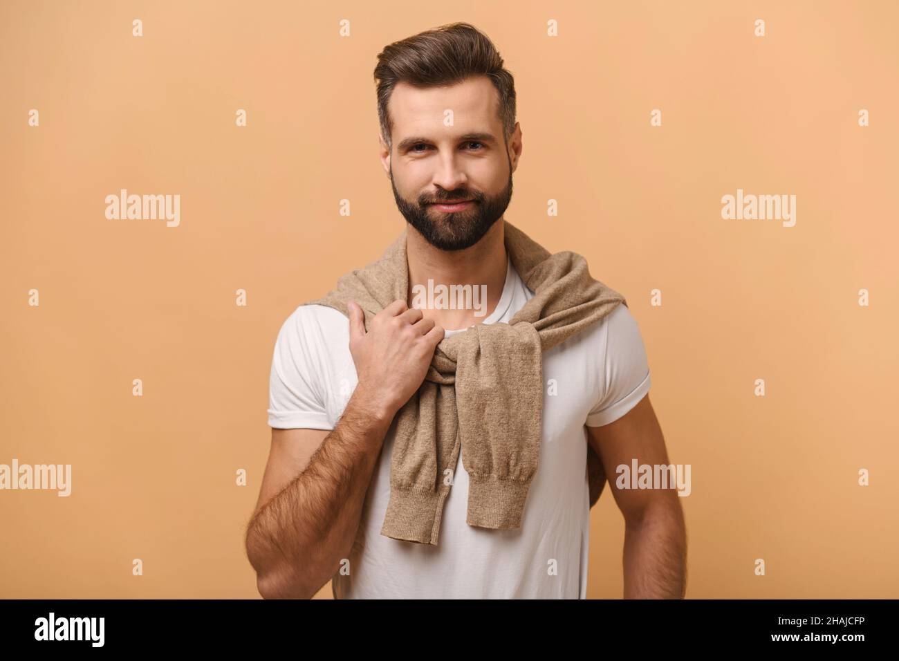 Portrait of happy smiley handsome bearded man with white t shirt posing ...