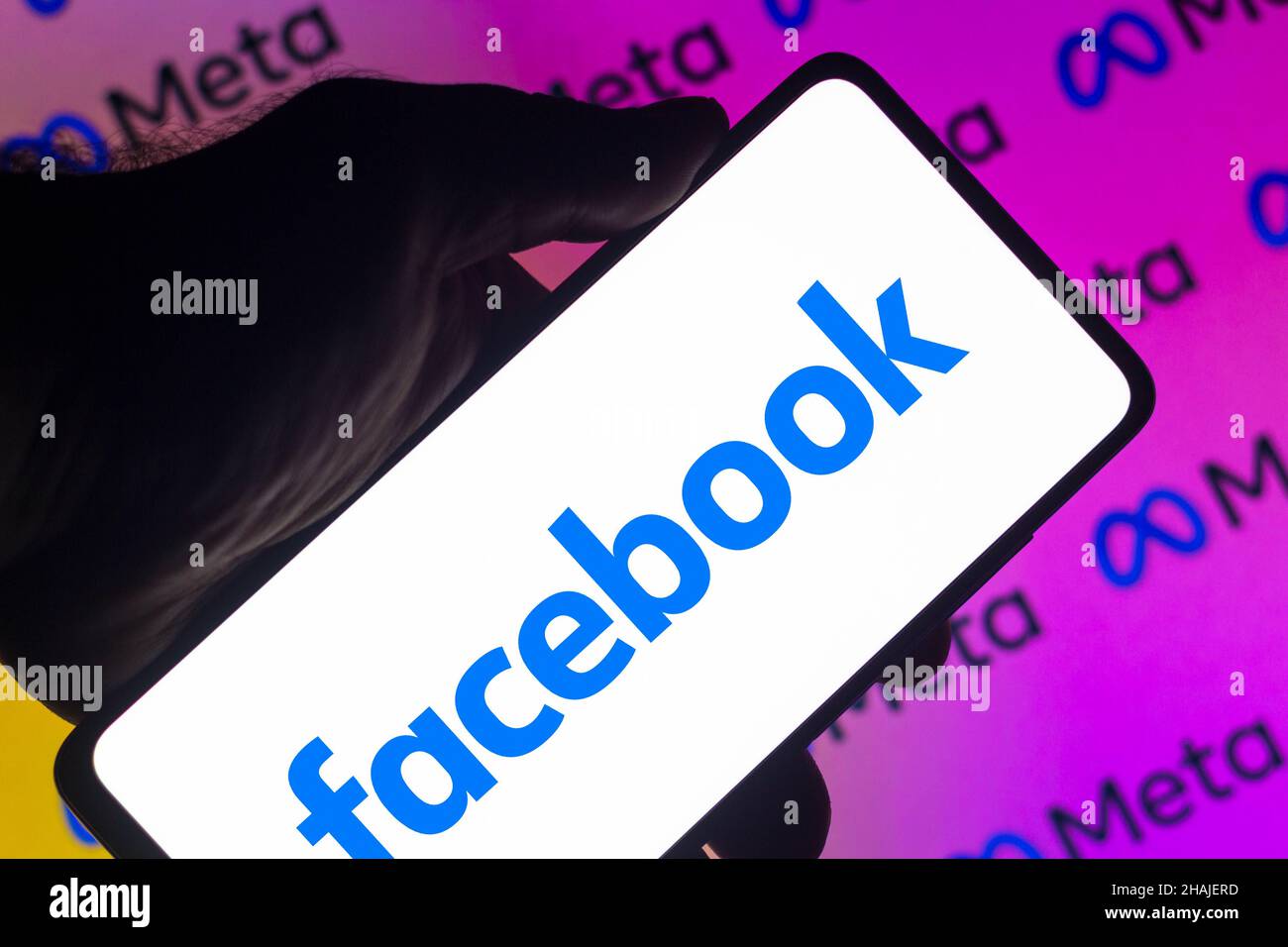 In this photo illustration a Facebook logo seen displayed on a ...