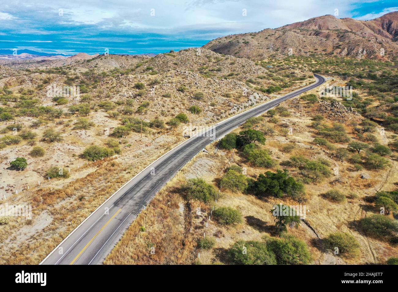 Aerial view of the landscape of the mountains and the road that goes ...